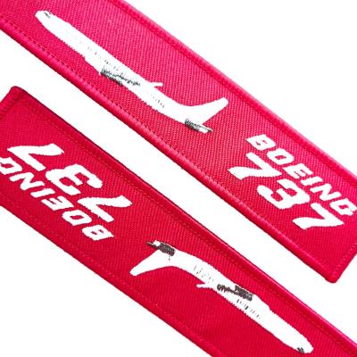 China Custom Promotional Logo Blank Cute Anime 3D 2 Sided Woven Fabric Embroidery Key Jet Tag Keychain for sale