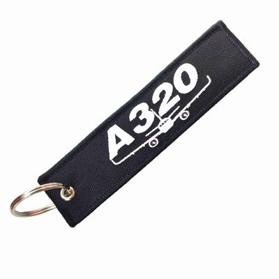 China Custom A320 Aircraft Keychain – Double-Stitched Polyester Fabric + Rust-Free Metal Hardware for sale