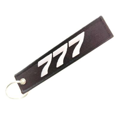 China Dubbelkleurige 777-sleutelhanger. Polyester en metalen fusie. Roestvaste hardware. Te koop