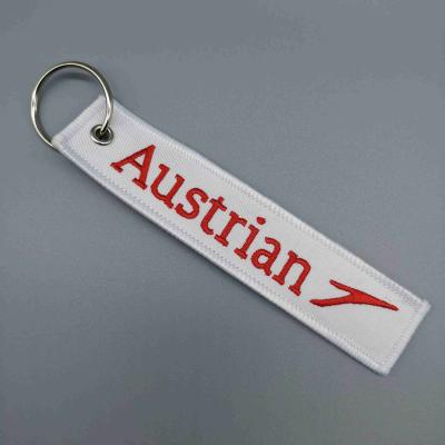 China Symmetrische vlucht tag Sleutelhanger Dubbele hechting Puur wit Aesthetisch Voor luchtvaart verzamelaar Te koop