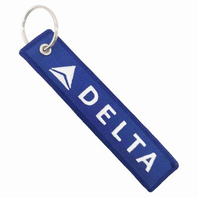 China Blauw-wit Custom geborduurde sleutelhanger Co-branded Gift DELTA Airlines Custom geborduurde sleutelhanger Te koop