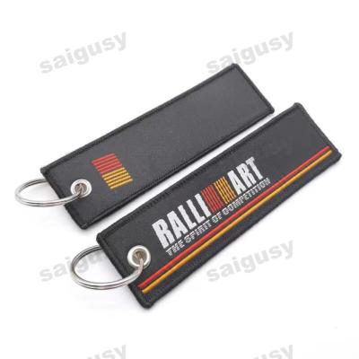 China Embroidered Design Black Gold Car Culture Key Fob with Metallic Tones and Contrast Stitching Design Custom Logos Welcome for sale