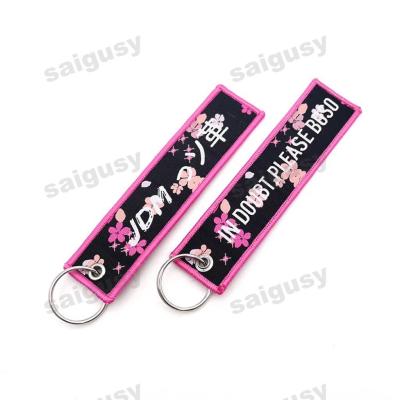 China Custom Car Embroidery Keychain with Cherry Blossom Accents - Durable Stitching & Unique Gift for Auto Lovers for sale
