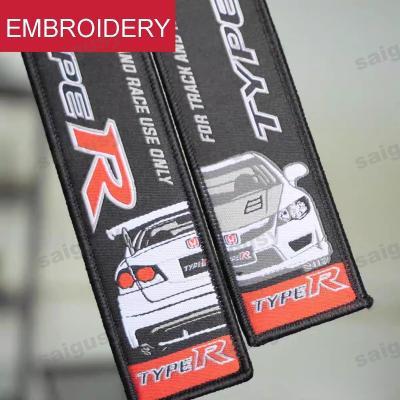 China Custom Car Embroidery Keychain with Cherry Blossom Accents - Durable Stitching & Unique Gift for Auto Lovers for sale