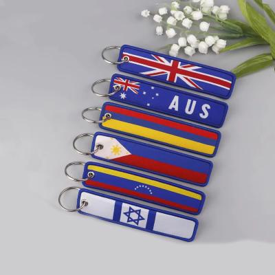 China LBR Gift Custom Jet Tag Woven Keychain with Your Own Logo Free Sample Cheap Flight Tag for sale