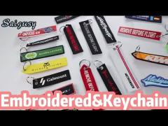 Diseño bordado de oro negro Car Culture Key Fob con tonos metálicos y contraste diseño de costuras de costuras bienvenido