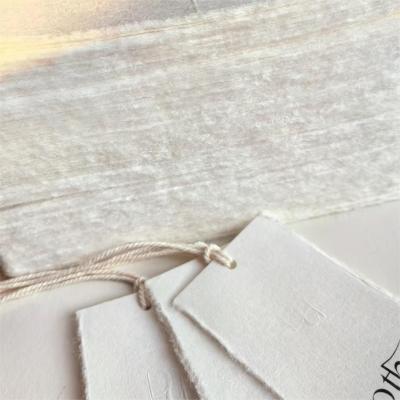 China Cold Stamping Custom Gift Tags Paper Anti Counterfeit Labels Kraft Paper Hang Tags Printable for sale