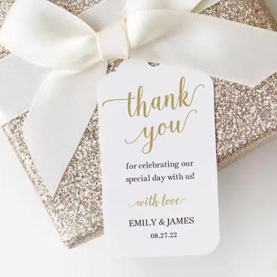 China Luxury Hangtag Labels Embossed Matte Finish Hot Stamping Business Card Tags for sale