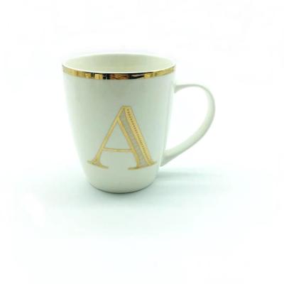 Cina Decalcomania dorata di 11 Oz che stampa la tazza bevente del caffè ceramico messa con il bordo dell'oro in vendita