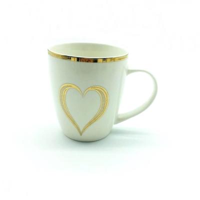 Cina Decalcomania dorata di 11 Oz che stampa la tazza bevente del caffè ceramico messa con il bordo dell'oro in vendita