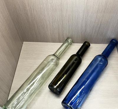 中国 無料で提供されるガラスボトル 500ml 375ml 対応蓋付きの緑色オリーブ油ボトル 販売のため