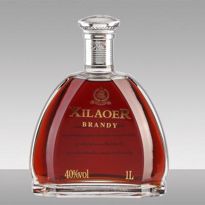 Cina Logo personalizzato Bottiglia di vetro a forma di oblate trasparente per 500 ml 750 ml di liquore di whisky brandy in vendita