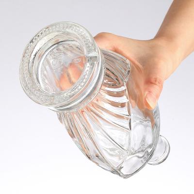 中国 カスタムデザイン 丸い形 750ml ガラスウイスキーボトル コークとクリア 販売のため