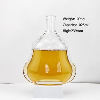 Cina 1000ml Spiriti a forma di zucca Bottiglia in vetro di brandy con tappo chiaro e design unico in vendita