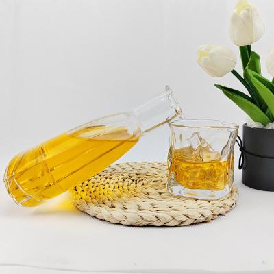 China 500ml Clear Flat Round Empty Whiskey Spirit Tequila Vodka Brandy Glass with Stopper for sale