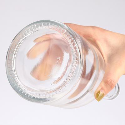Cina 500 ml 750 ml bottiglia di vino in vetro a forma unica per liquori OEM/ODM Benvenuti in liquori in vendita