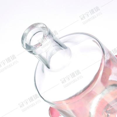 China 750 ml de Vodka cilíndrica Garrafa de vidro de vinho Garrafa de vidro com manuseio de superfície de gravação ácida à venda