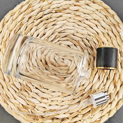 Cina Bottiglia di vetro per profumi quadrata trasparente da 50 ml a 100 ml con superficie stampata a caldo in vendita