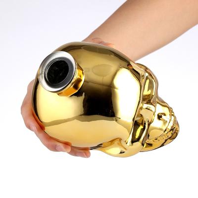 Cina Tappo di gomma Scheletro forma bottiglie di vetro Elettroplacca d'oro Vino di lusso Logo personalizzato in vendita