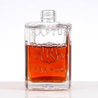 China Pattern Customized Logo Clear Glass 700ml Square Bottle for Wine and Beer Empty in Carving Patterns for sale