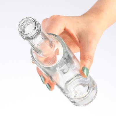 Cina Bottiglia di tequila vuota di 750 ml chiara con coperchio e superfici stampate a caldo in vendita