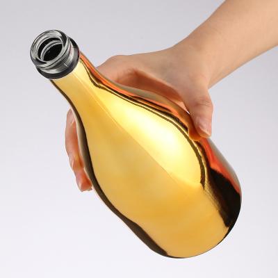 Cina Corpo in vetro Disegno personalizzato 700ml 750ml Extra Flint Metallic Gold Bottiglia di champagne con sughero in vendita