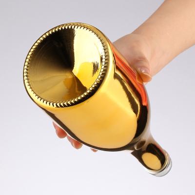 Cina Corpo in vetro Disegno personalizzato 700ml 750ml Extra Flint Metallic Gold Bottiglia di champagne con sughero in vendita