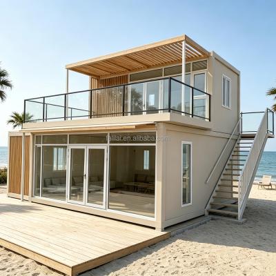 China Large View 2-storey Cream Color Glass Curtain Wall Knock Down Flat Pack Container Villa Prefab Modular Seaside Resort Apartment for sale
