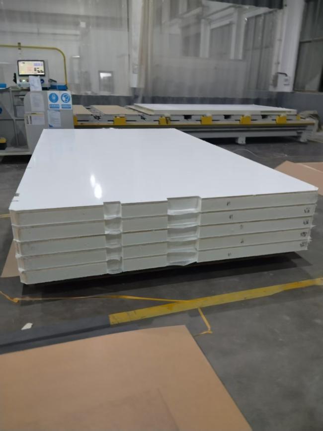 Close-up view of machining center work surface and controls