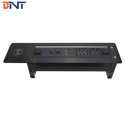 China Motorized Hidden Rotate Flip Up Power Outlet With Wireless Charger for sale