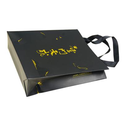 Cina sacco di carta del tessuto C1S di 40cm che stampa rifinitura UV laminata del punto in vendita