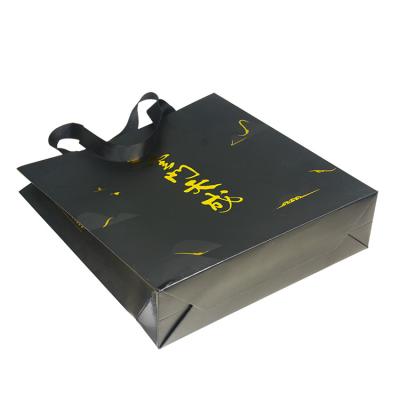 Cina sacco di carta del tessuto C1S di 40cm che stampa rifinitura UV laminata del punto in vendita