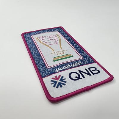 Cina Confine su ordinazione di Logo Uniform Woven Badge Merrow cucire sulle toppe del ricamo per l'indumento in vendita