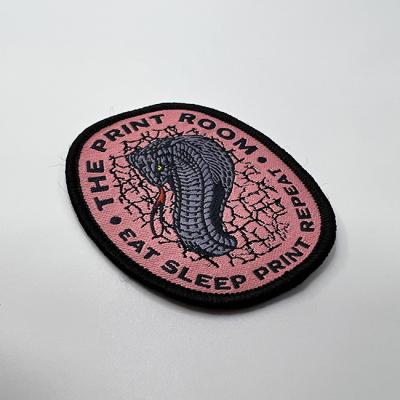 中国 Merrowのボーダー注文の編まれたパッチの自己接着皮および棒はパッチを刺繍した 販売のため