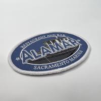 China Custom Woven Hat Patch with Merrow Border Iron On Backing 100pcs MOQ for sale