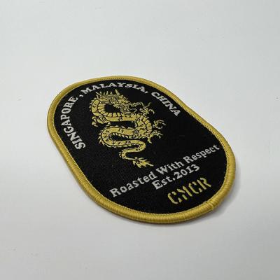 Cina Confine adesivo su misura di Dragon Embroidery Patches Shrink Proof Merrow della colata in vendita