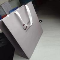 China Ribbon Handle Apparel Paper Bag for sale
