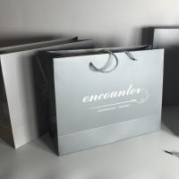 China Ribbon Handle Apparel Paper Bag for sale