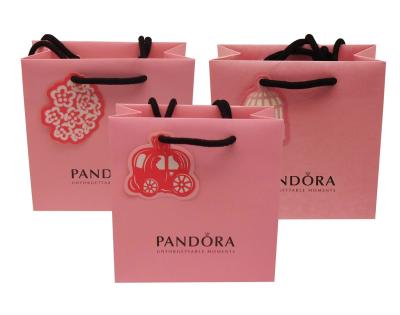 China Personalised customized color packing paper bag with black  handle for sale