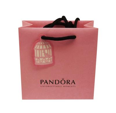 China Personalised customized color packing paper bag with black  handle for sale