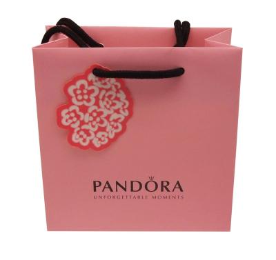 China Personalised customized color packing paper bag with black  handle for sale