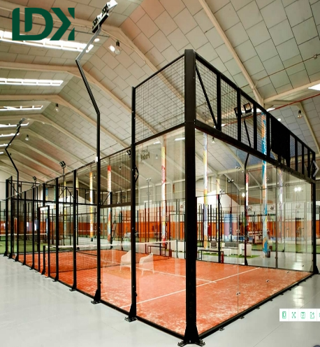 Professional padel court overview showing steel and glass structure
