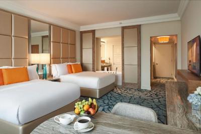 China PHNOM PENH Luxury hotel bedroom furniture made by Leather upholstery headboard with bed and Wood TV table combined desk for sale