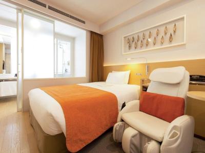 China Tonga hotel interior design of custom furniture laminate wood headboard bed with massage chair and in wall cabinet desk for sale