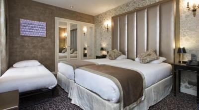 China Nigeria luxury hotel bedroom furniture set of golden headboard bed with sofa bench and wood writing table for sale