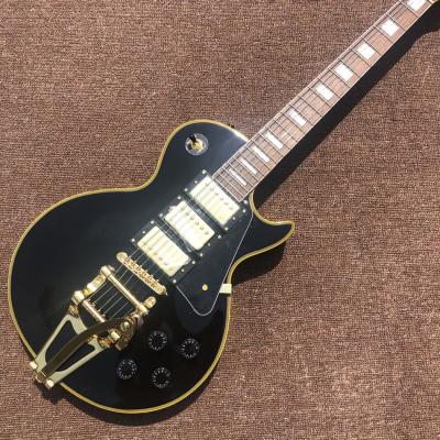 China Custom Yellow Binding Gold Hardware Bigsby Tremolo LP Electric Guitar for sale