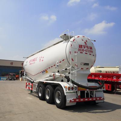 Cina Camion cisterna asciutto pneumatico del rimorchio dei semi del cemento delle polveri sfuse nel Mozambico in vendita