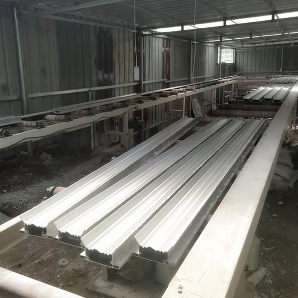 Automatic Gypsum Cornice Machine in operation showing production process