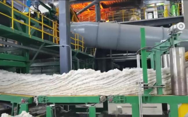 Rock wool production line machinery in operation showing automated manufacturing process