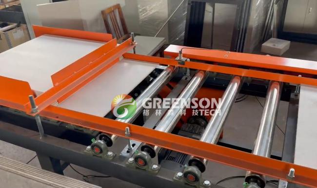 Close-up view of gypsum ceiling tile production